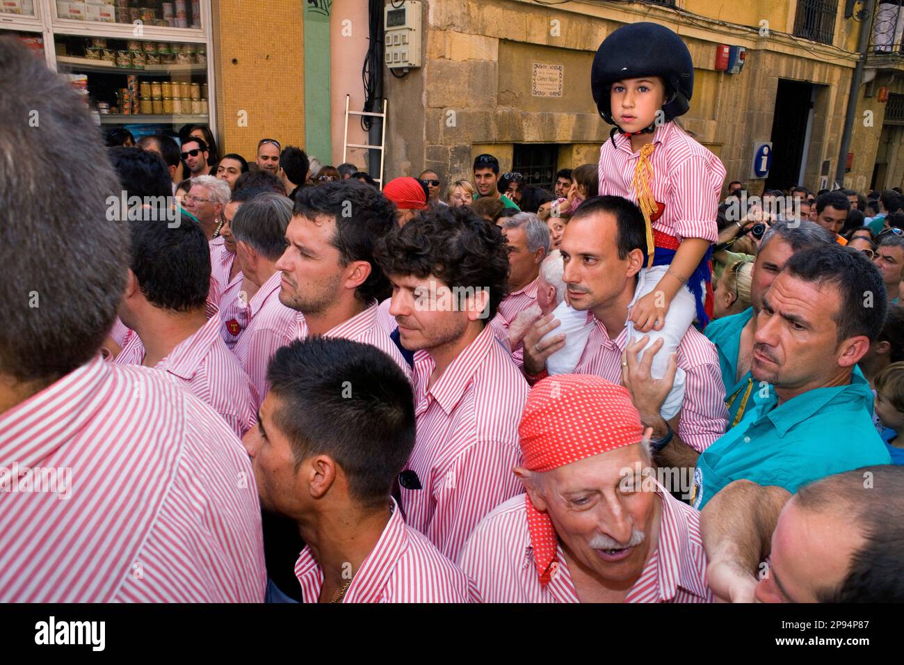 Xiquets de Tarragona.`Enxaneta´girl who rises to the top of the human tower.'Castellers' is a ...